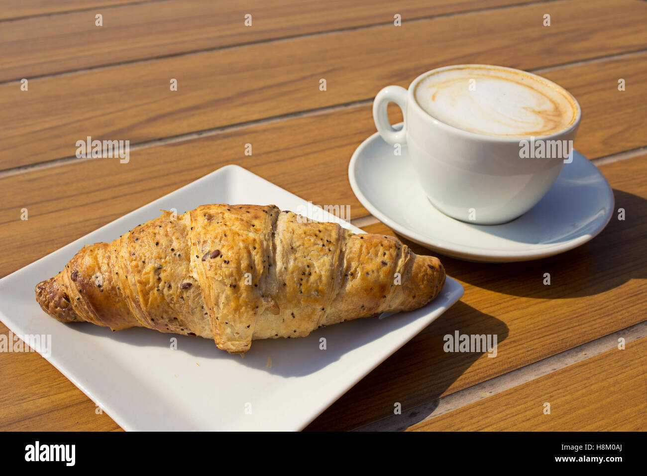 Italian typical creamy hot Cappuccino with five cereals light brioche ...