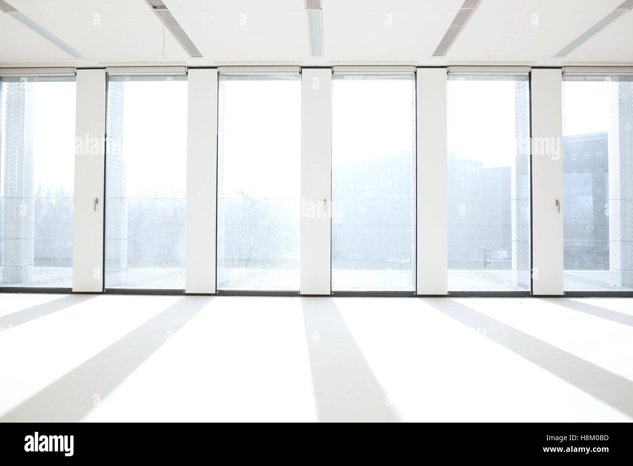 Windows in lobby of office building Stock Photo - Alamy