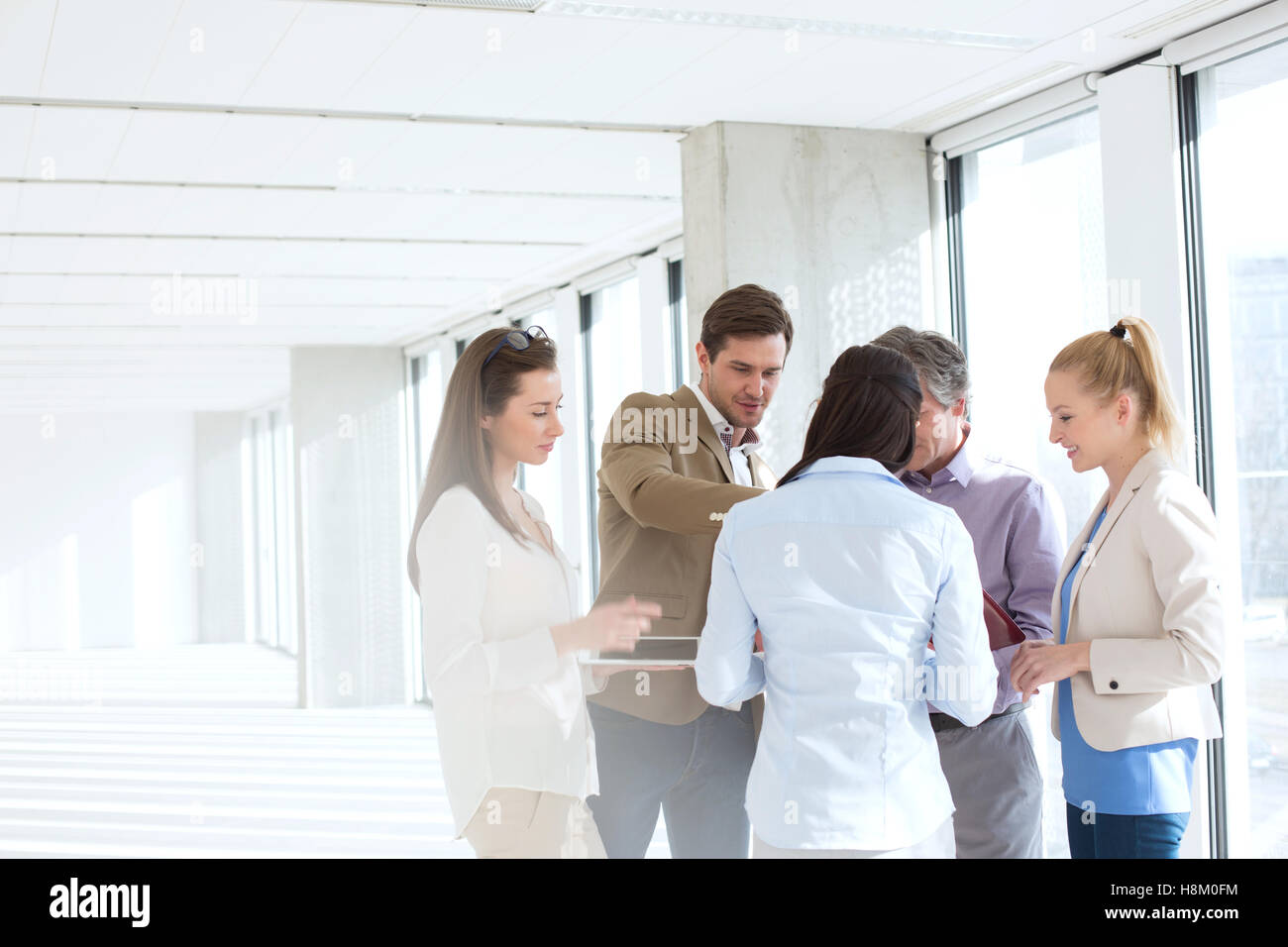 Business people having discussion in empty office Stock Photo - Alamy