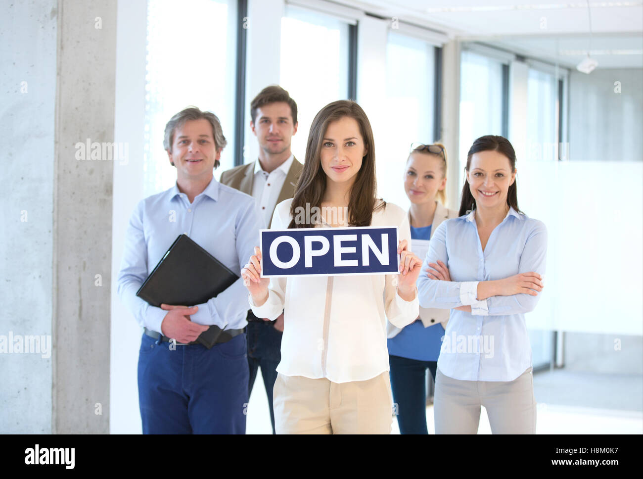 Five people holding sign hi-res stock photography and images - Alamy