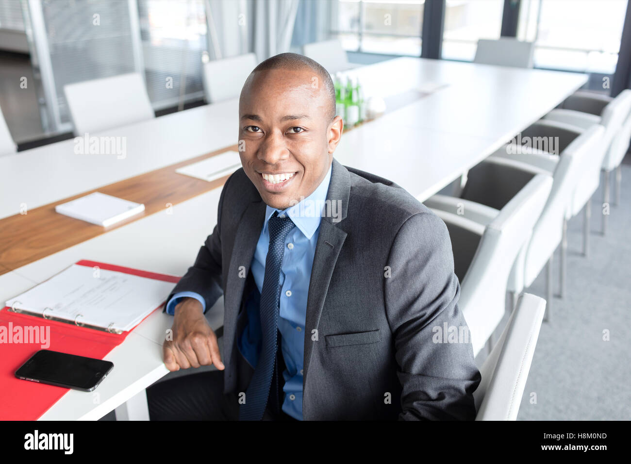 Businessman sitting conference table hi-res stock photography and ...