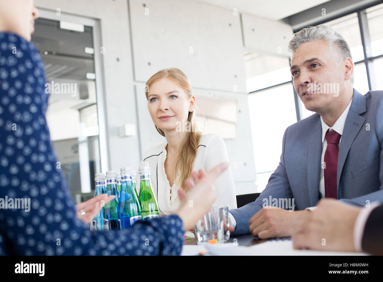 Business people having discussion in board room at office Stock Photo ...