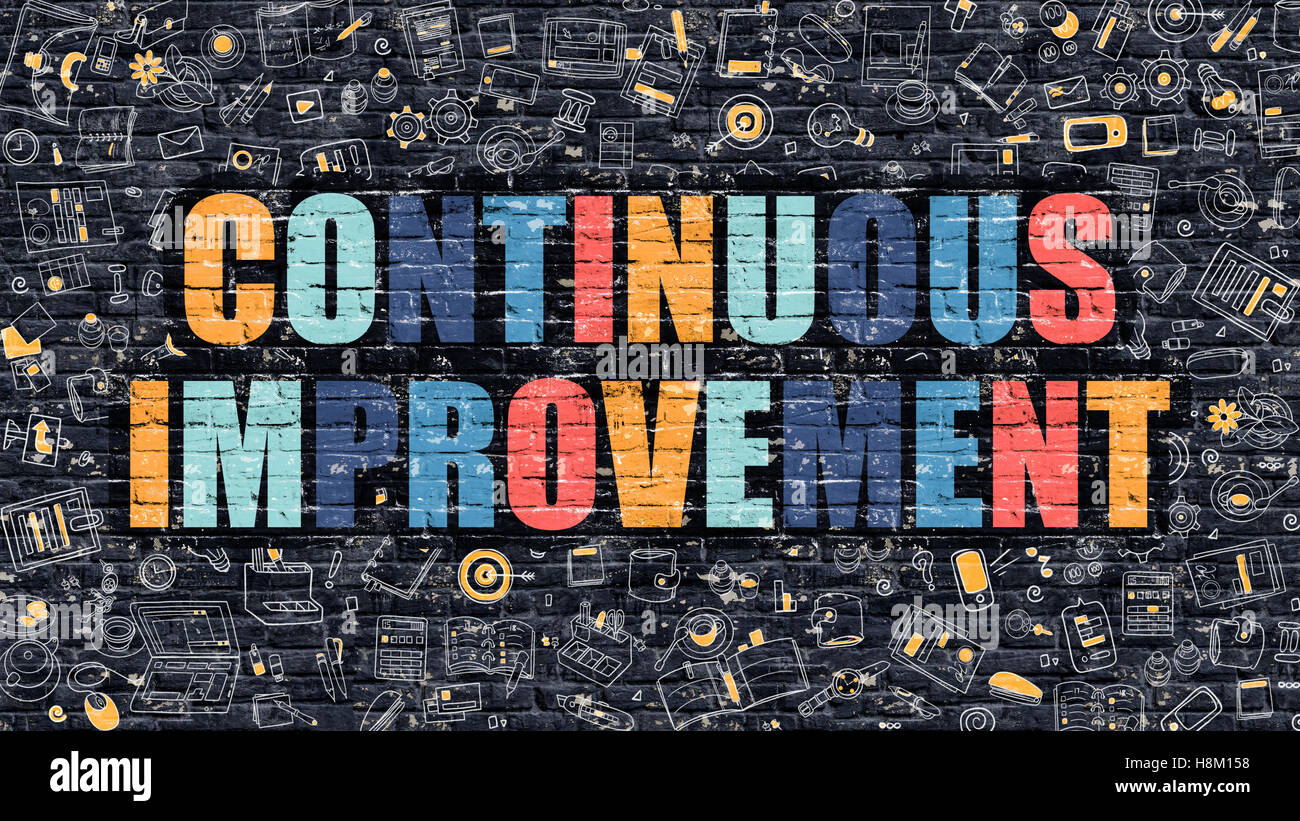 Multicolor Continuous Improvement on Dark Brickwall Stock Photo - Alamy