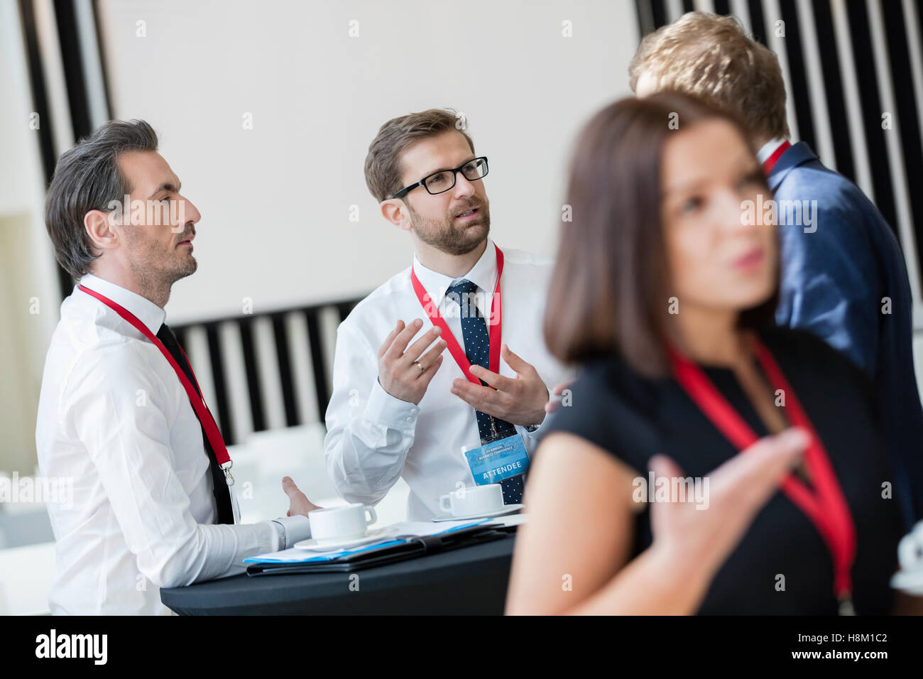 Business people talking during coffee break at convention center Stock ...