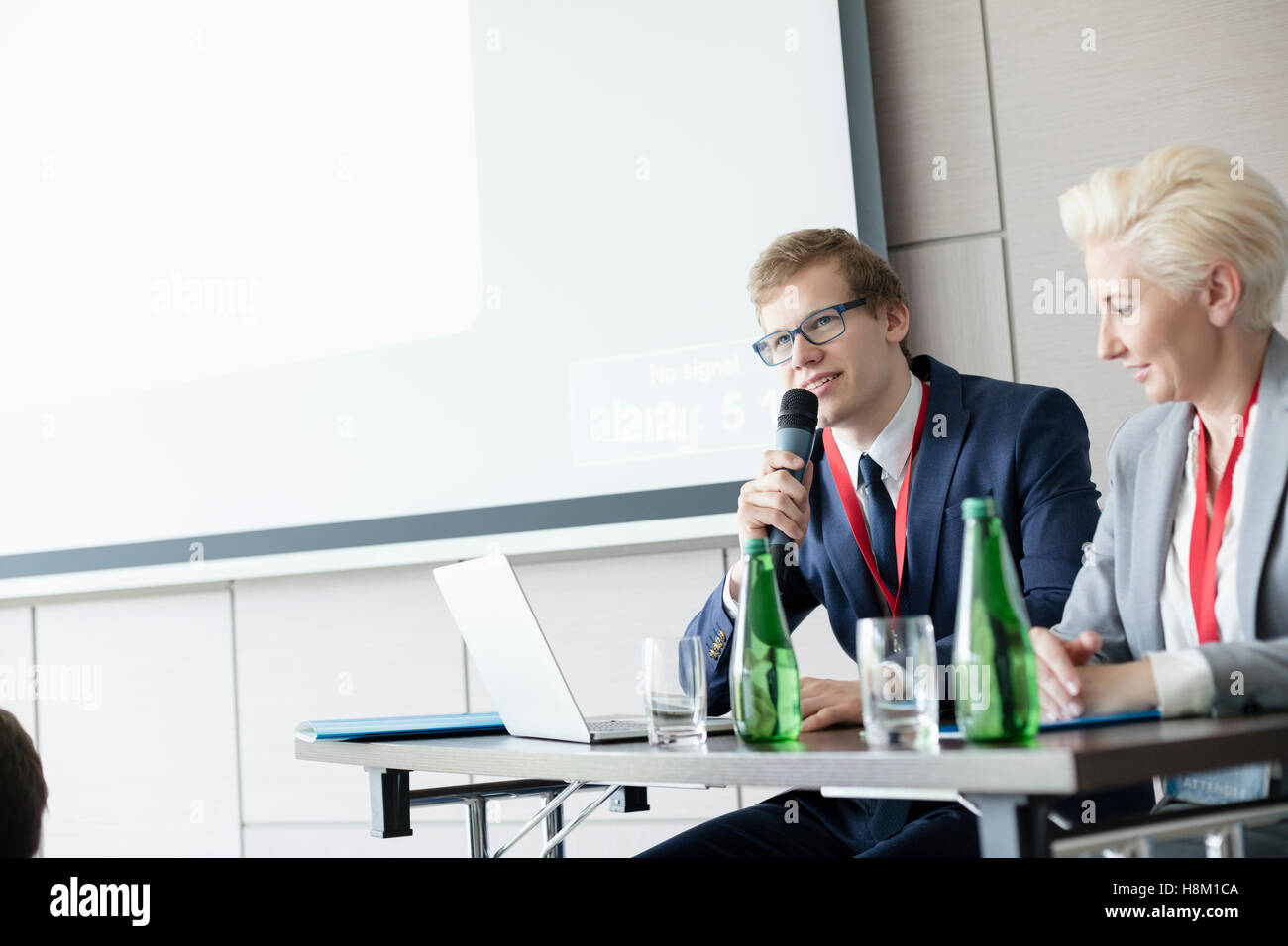 Speaking into microphone hi-res stock photography and images - Alamy