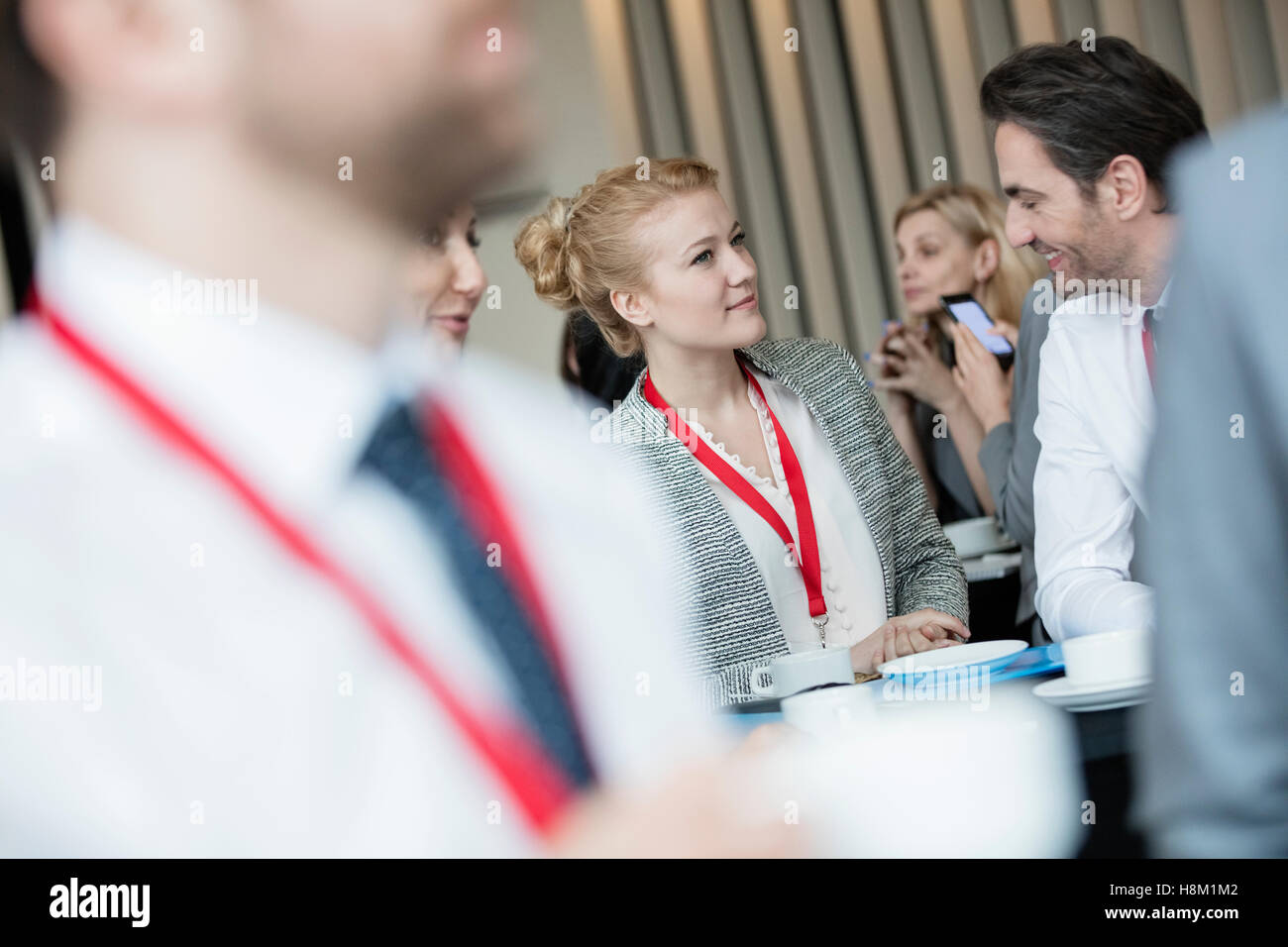 Business people talking at lobby in convention center Stock Photo - Alamy