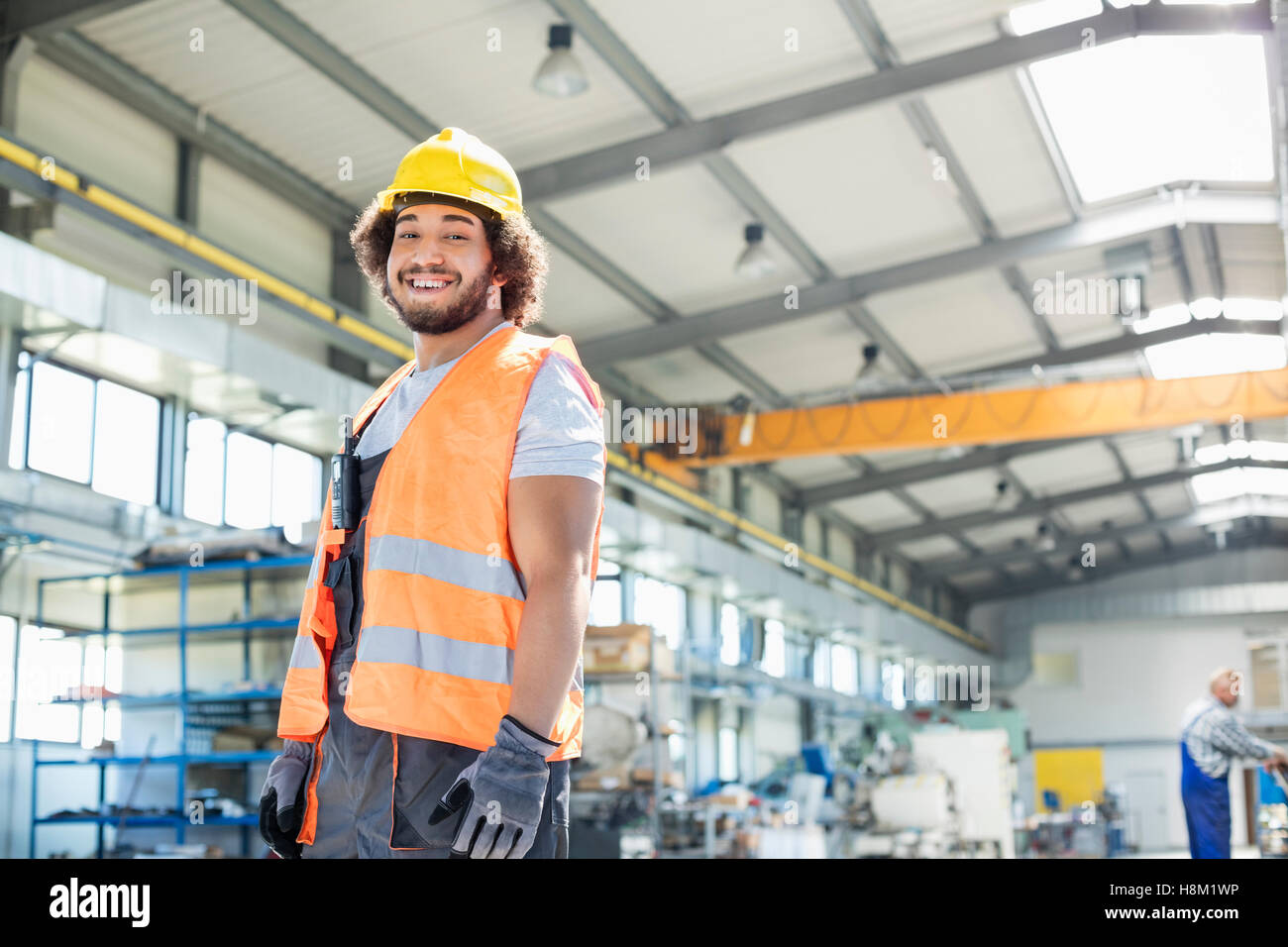 Worker smiling factory hi-res stock photography and images - Alamy