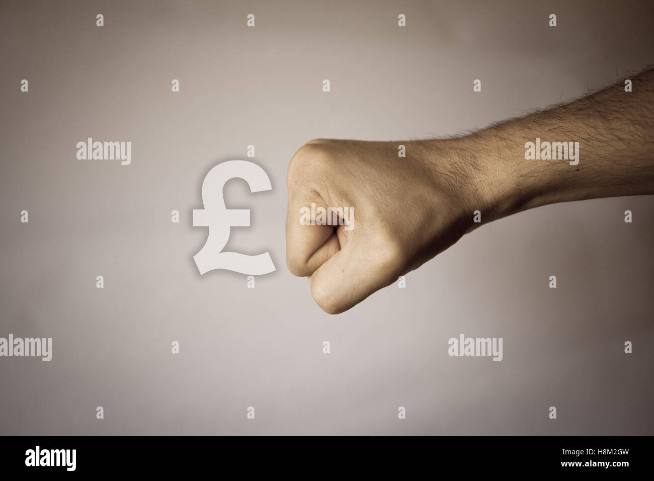 Human hand on vintage background to express strength against pound ...