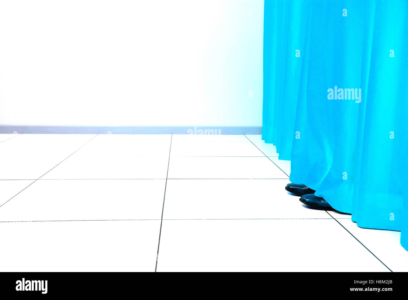 Feet Behind Curtain Stock Photo - Alamy