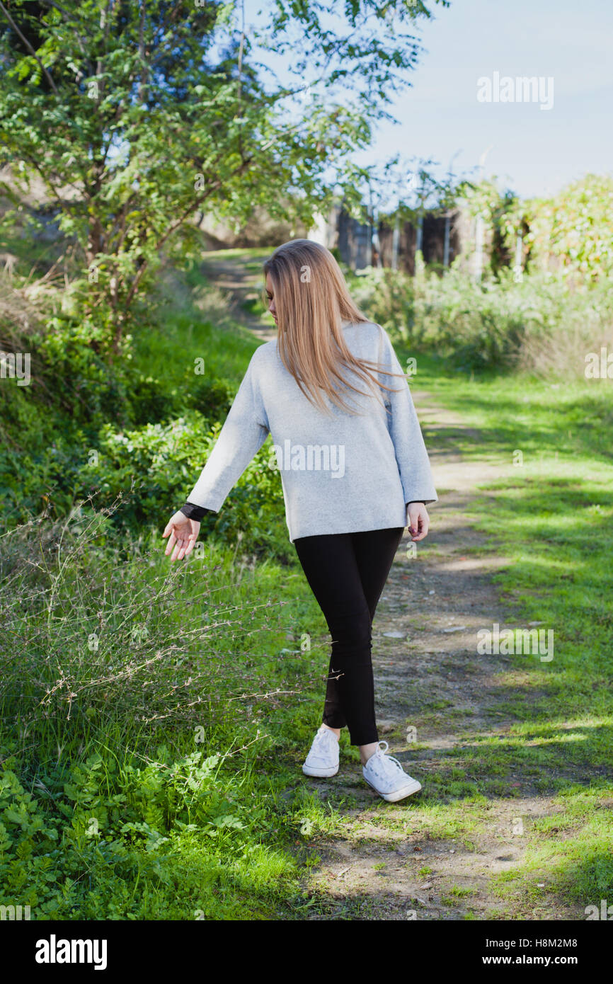 Young woman taking a walk in a relaxed day Stock Photo - Alamy