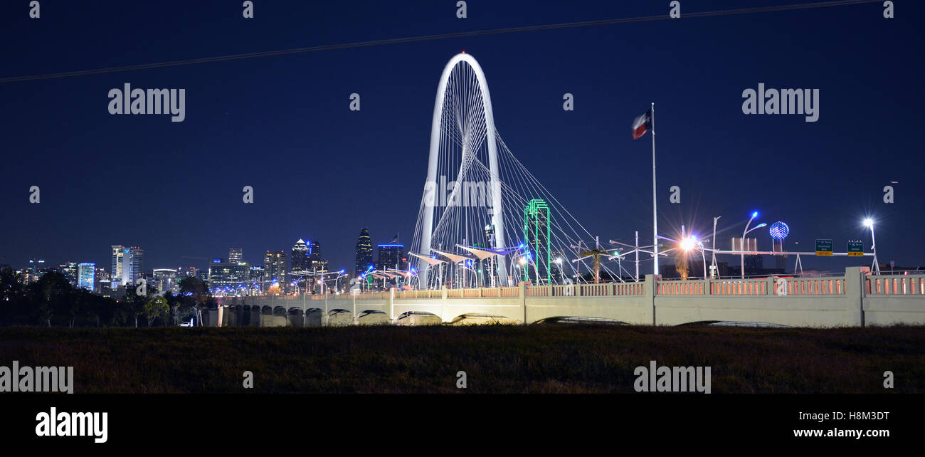 The Margaret Hunt Hill bridge is illuminated at night and provides ...