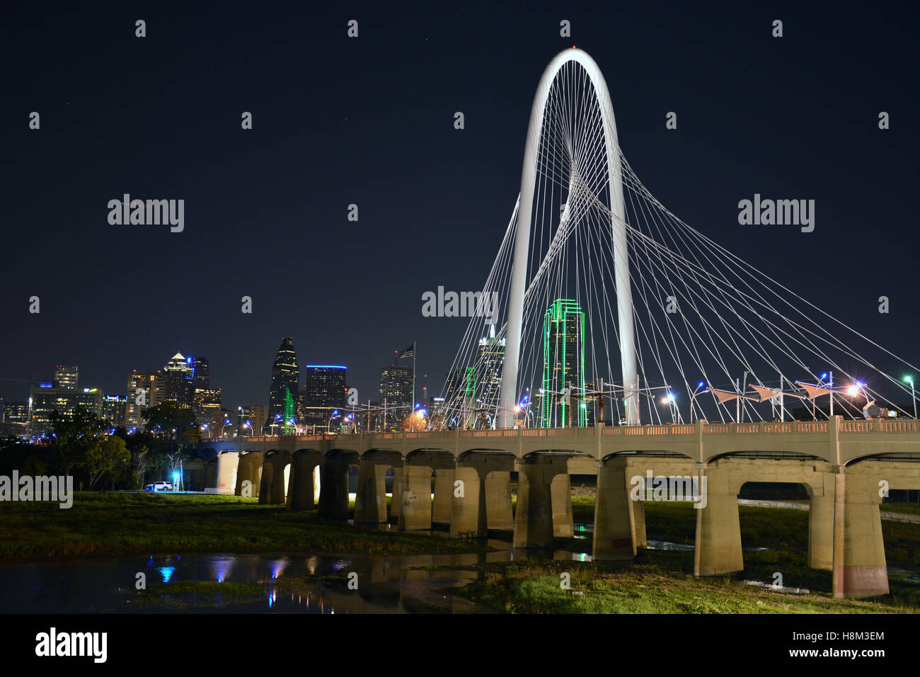 The Margaret Hunt Hill bridge is illuminated at night and provides ...