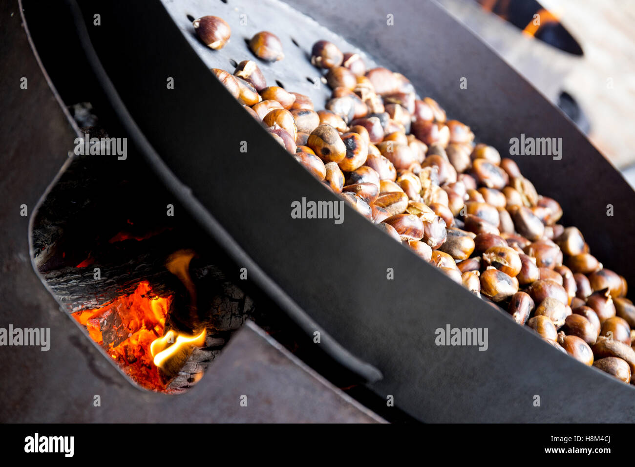 Organic Brown Chestnuts Roasting over a hot fire Stock Photo - Alamy