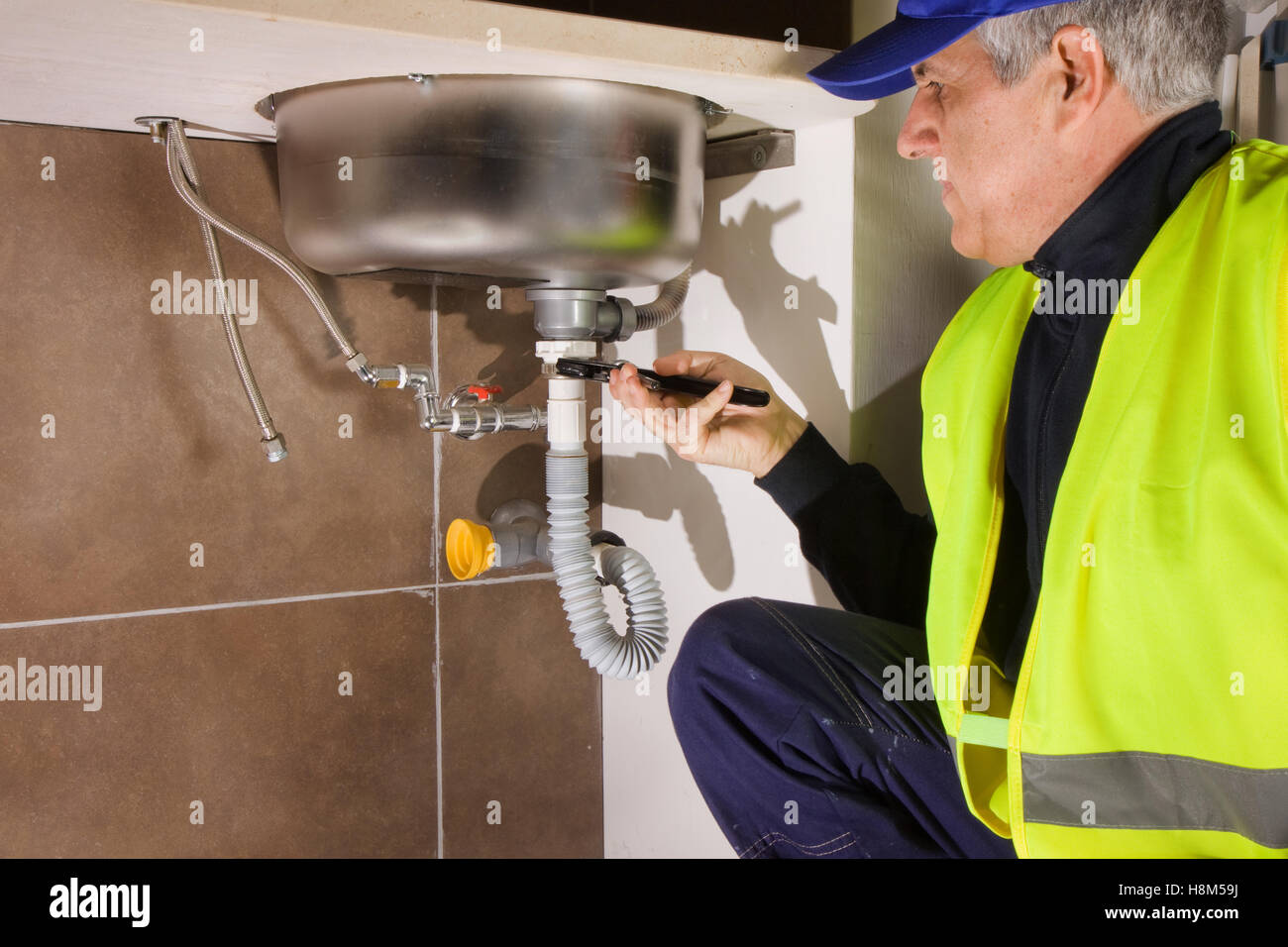 plumber at work in a building site Stock Photo - Alamy