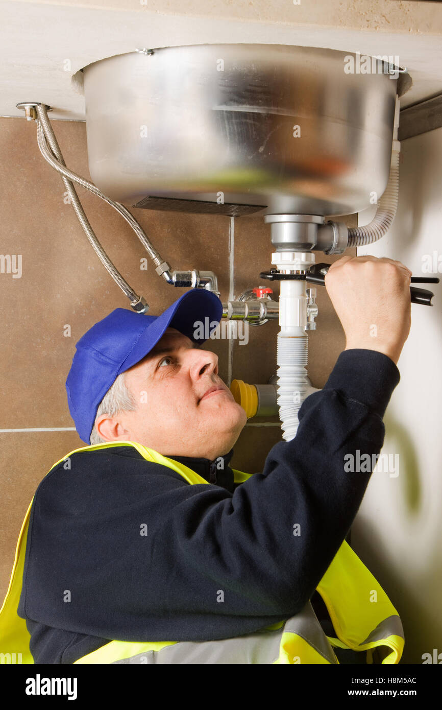 plumber at work in a building site Stock Photo - Alamy