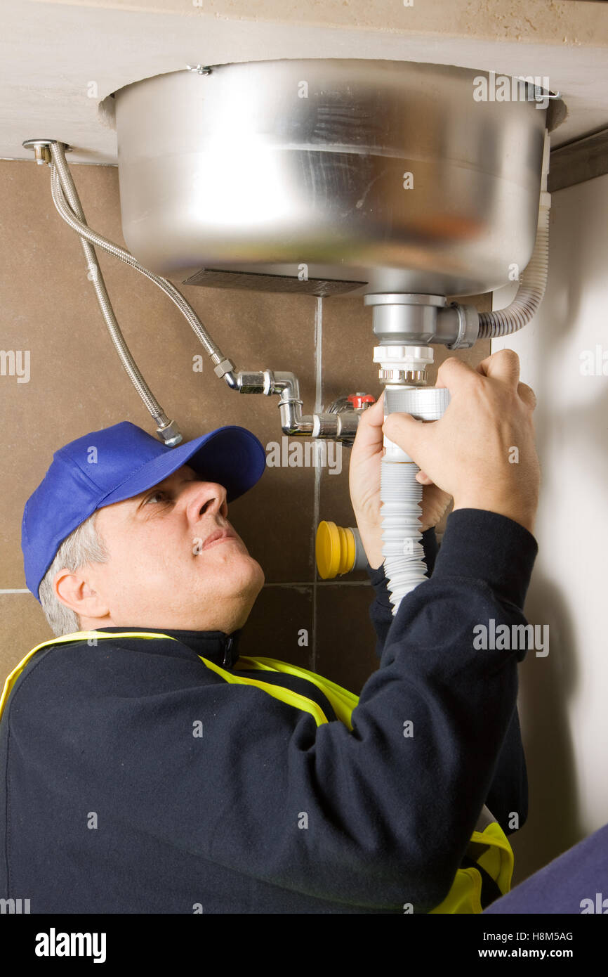 plumber at work in a building site Stock Photo - Alamy