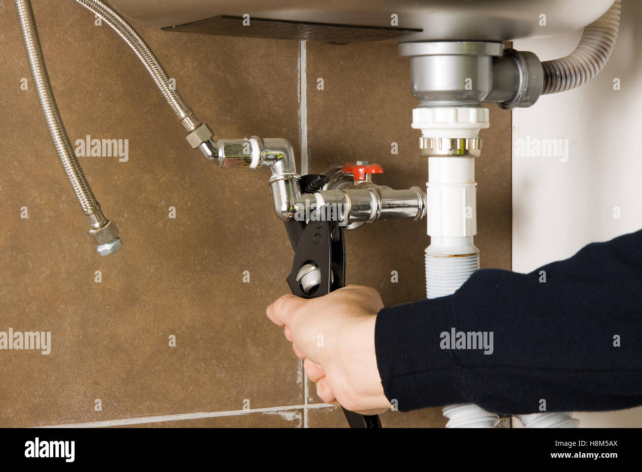 plumber at work in a building site Stock Photo - Alamy