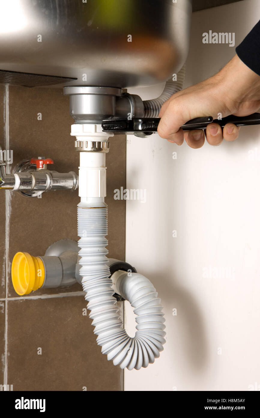 plumber at work in a building site Stock Photo - Alamy