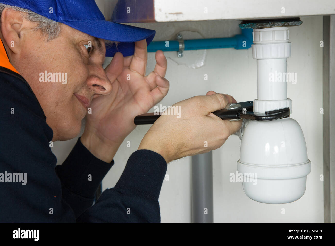 plumber at work in a building site Stock Photo - Alamy