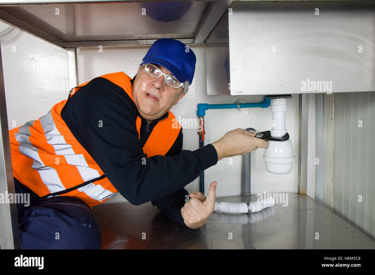 plumber at work in a building site Stock Photo - Alamy