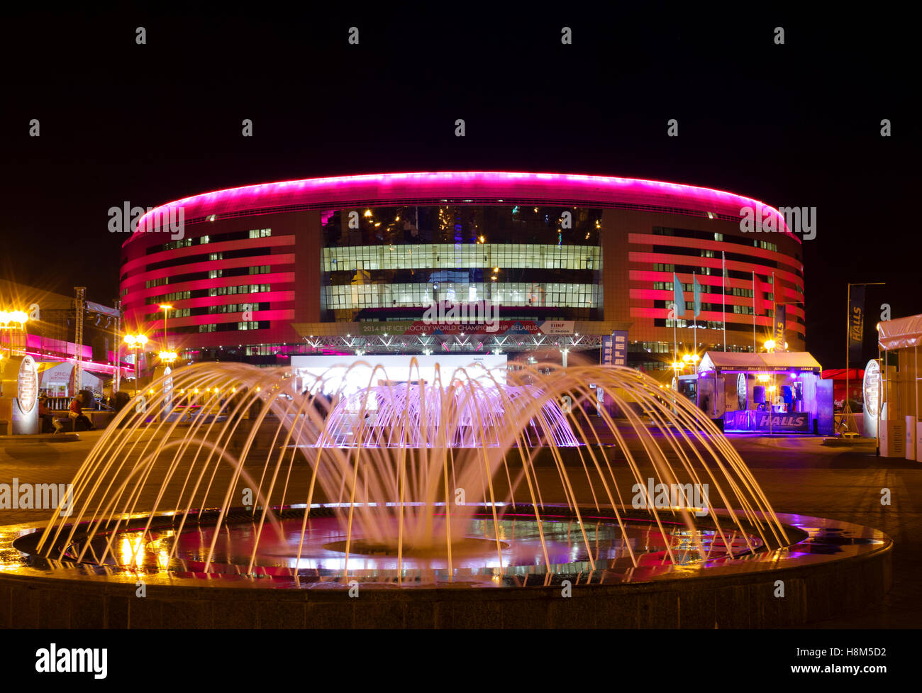 Minsk Arena building illuminated at night Stock Photo - Alamy
