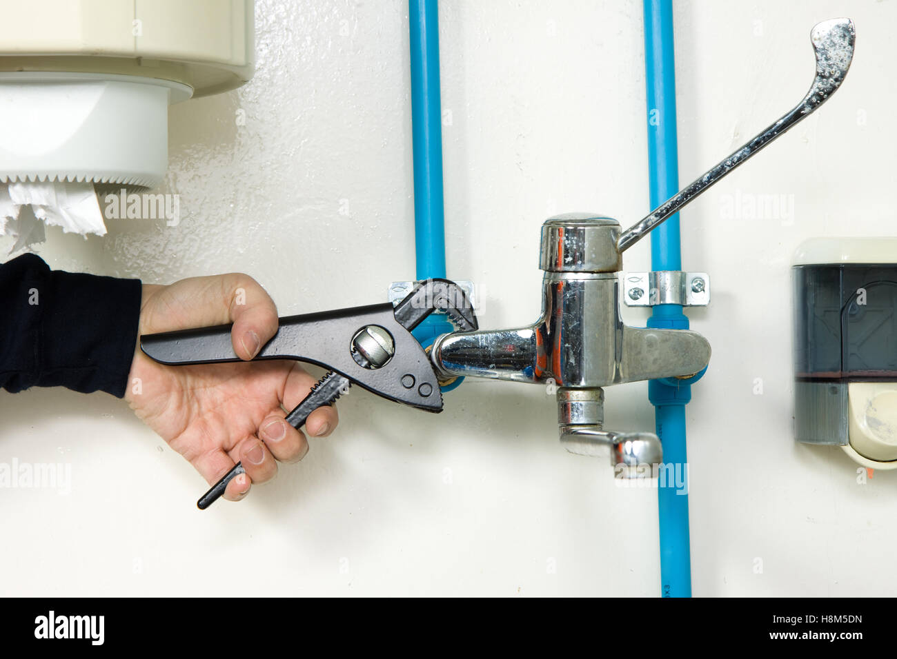 plumber at work in a building site Stock Photo - Alamy