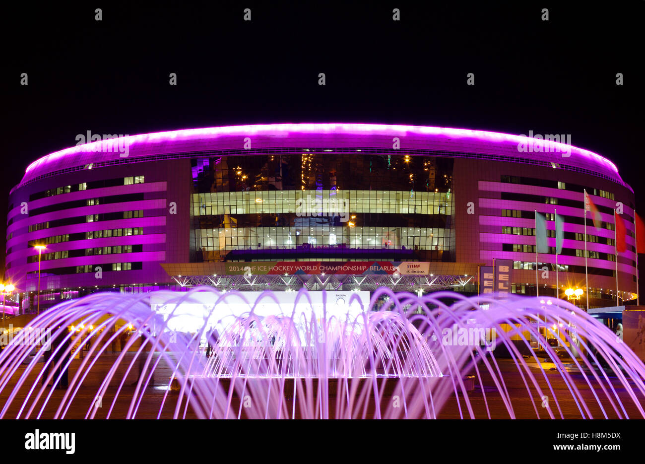 Minsk Arena building illuminated at night Stock Photo - Alamy