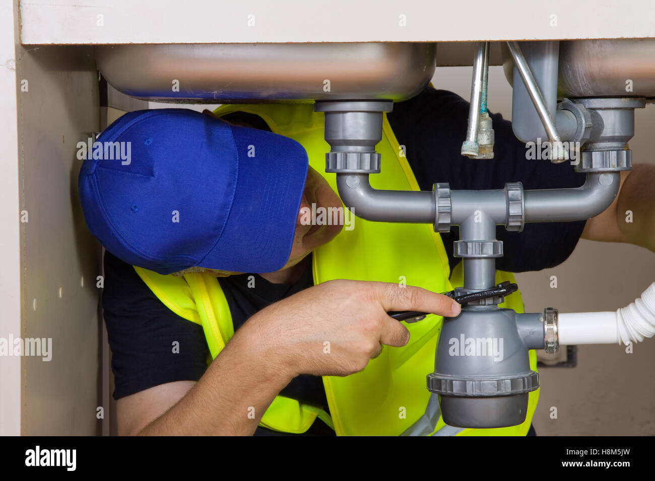plumber at work in a building site Stock Photo - Alamy