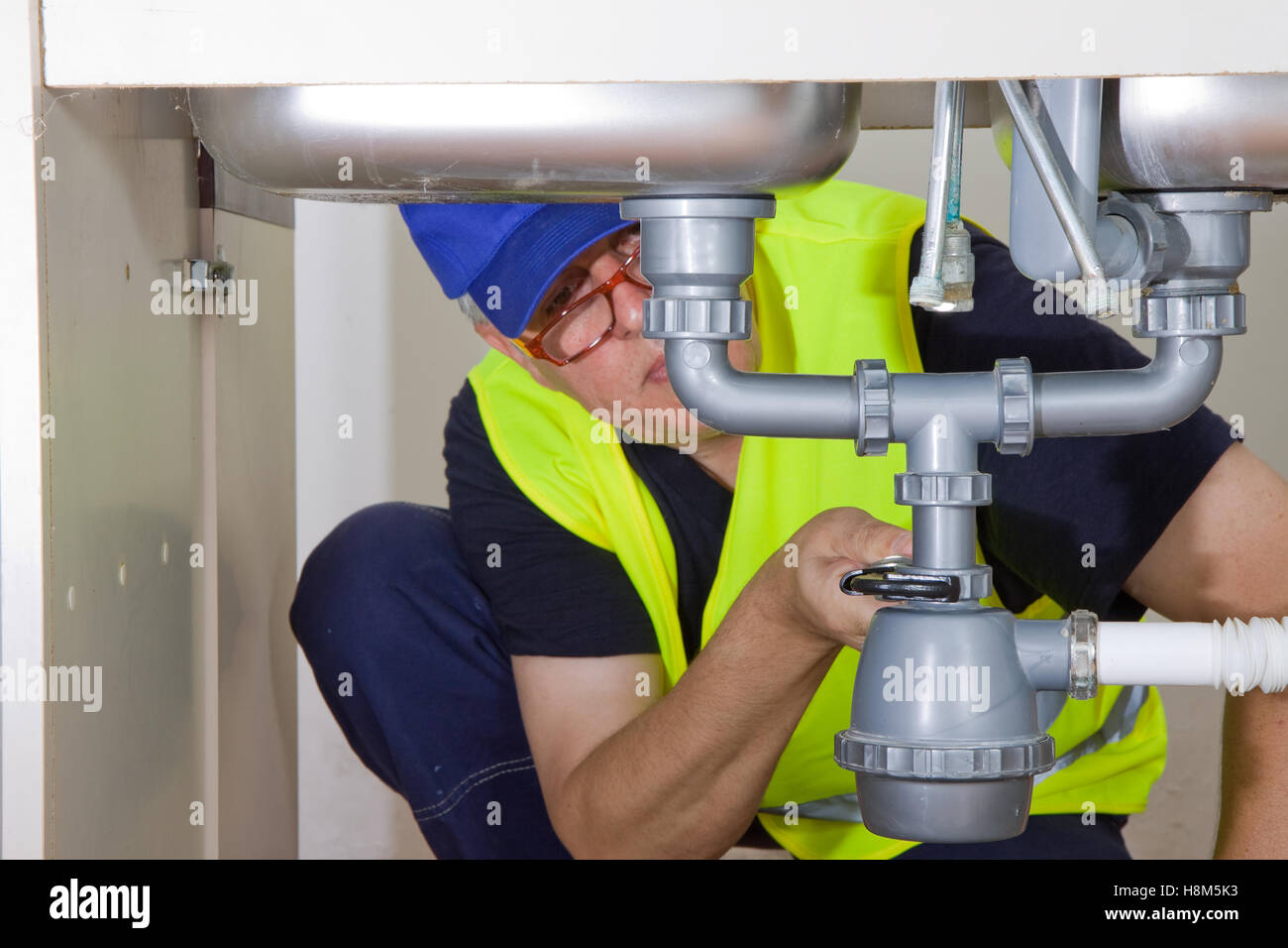 plumber at work in a building site Stock Photo - Alamy