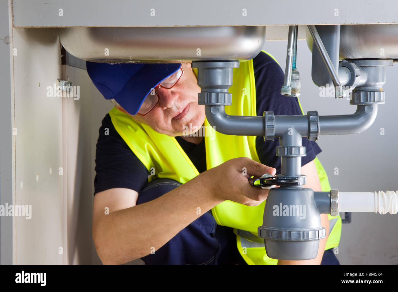 plumber at work in a building site Stock Photo - Alamy