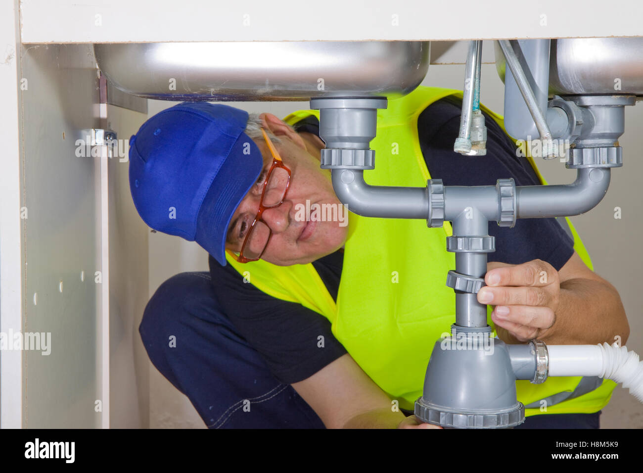 plumber at work in a building site Stock Photo - Alamy