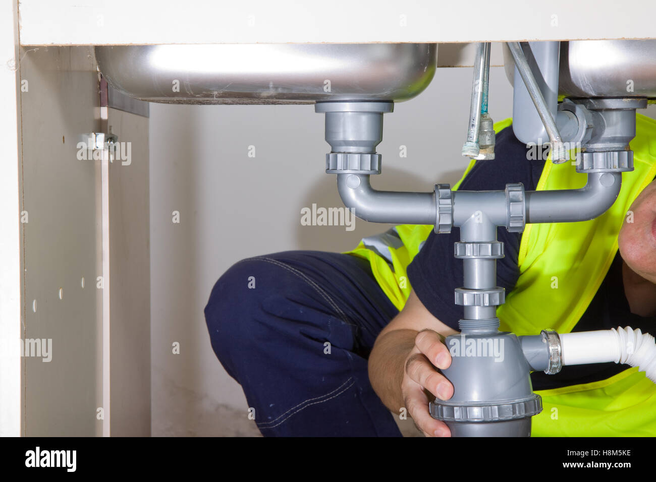plumber at work in a building site Stock Photo - Alamy