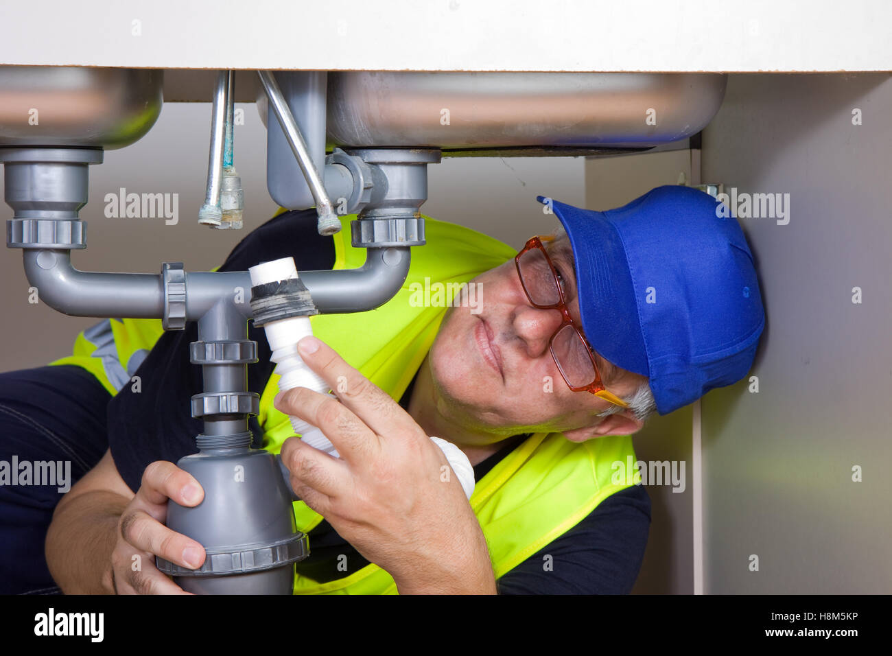 plumber at work in a building site Stock Photo - Alamy