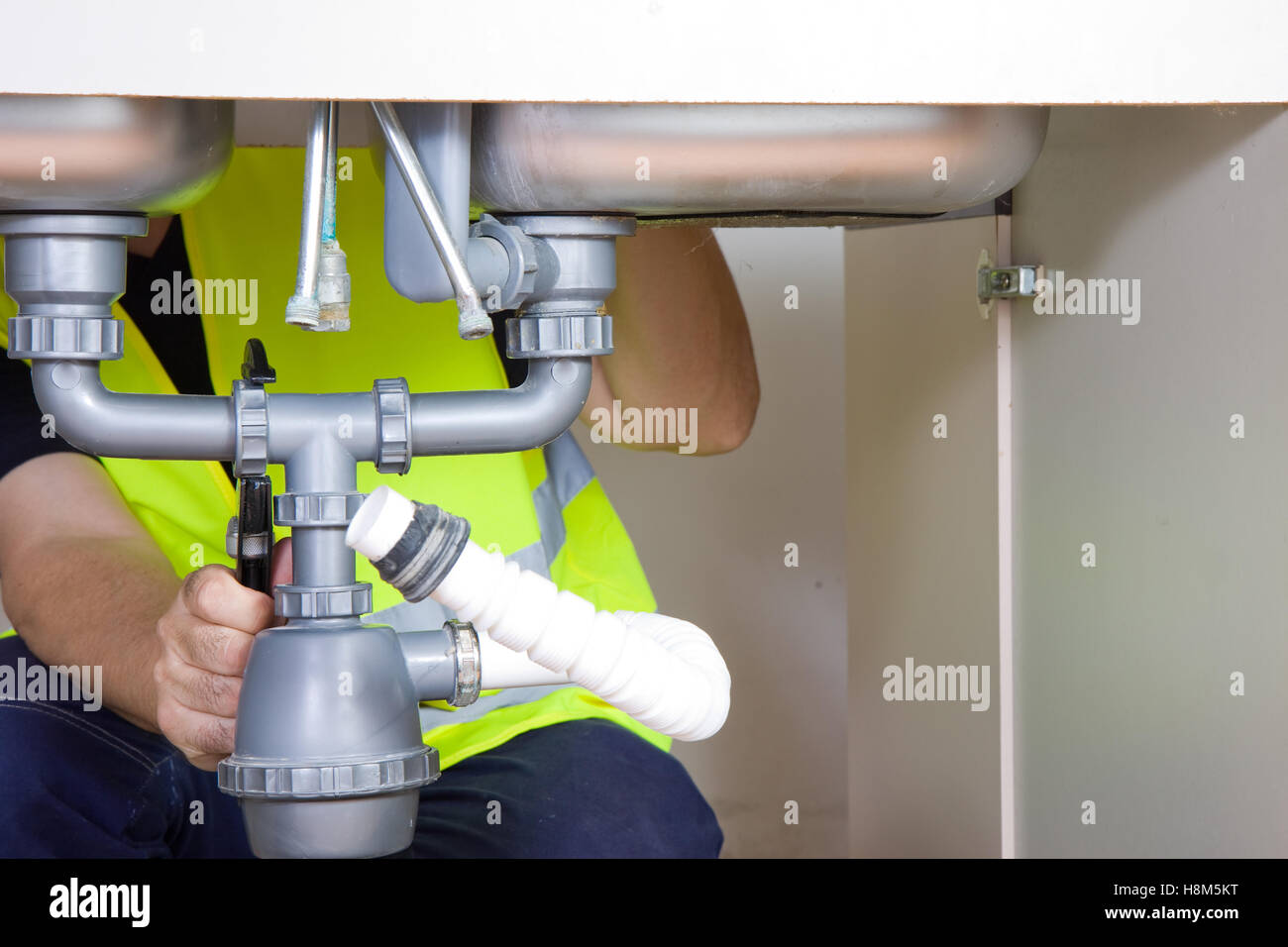 plumber at work in a building site Stock Photo - Alamy