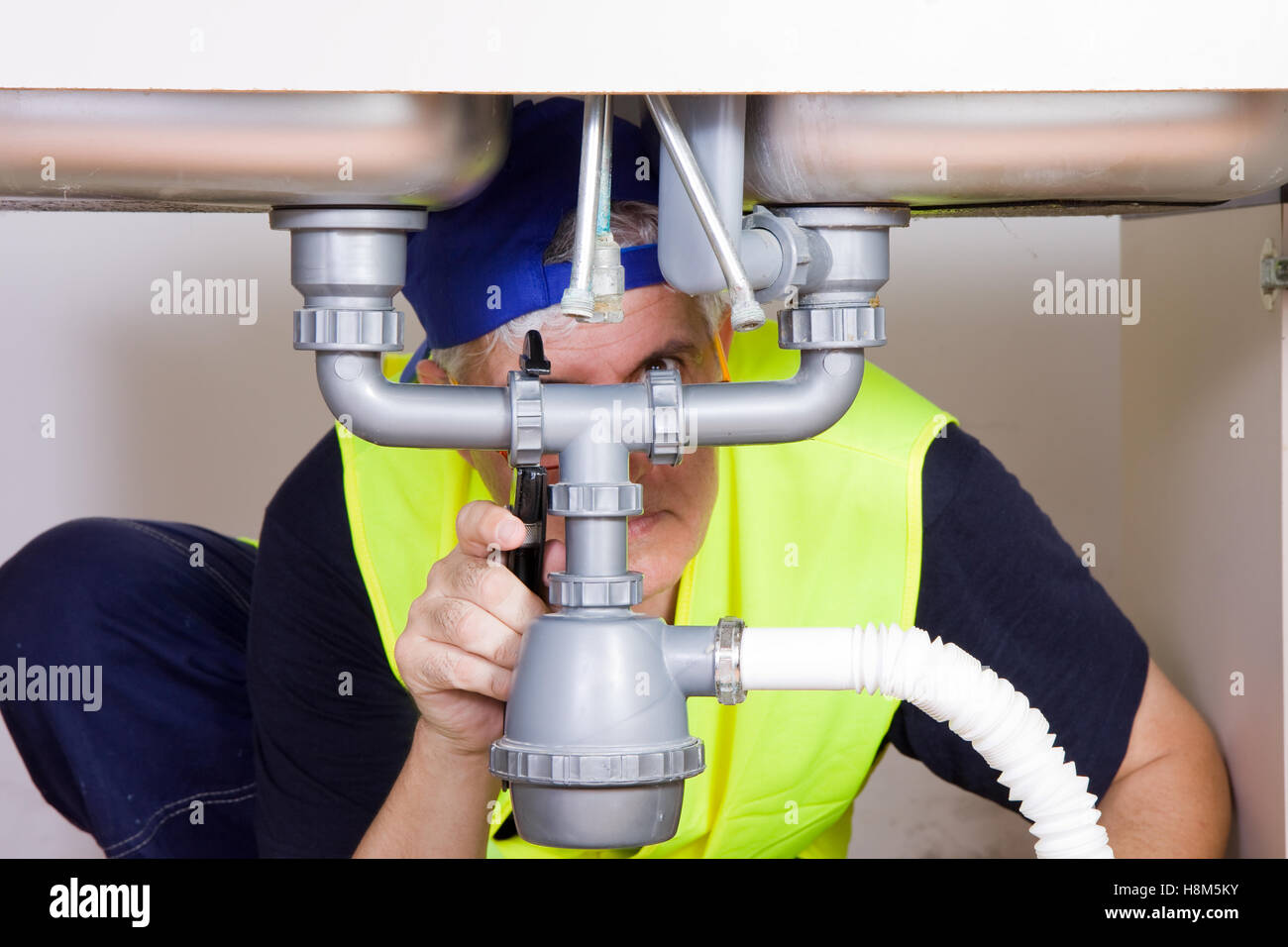 plumber at work in a building site Stock Photo - Alamy