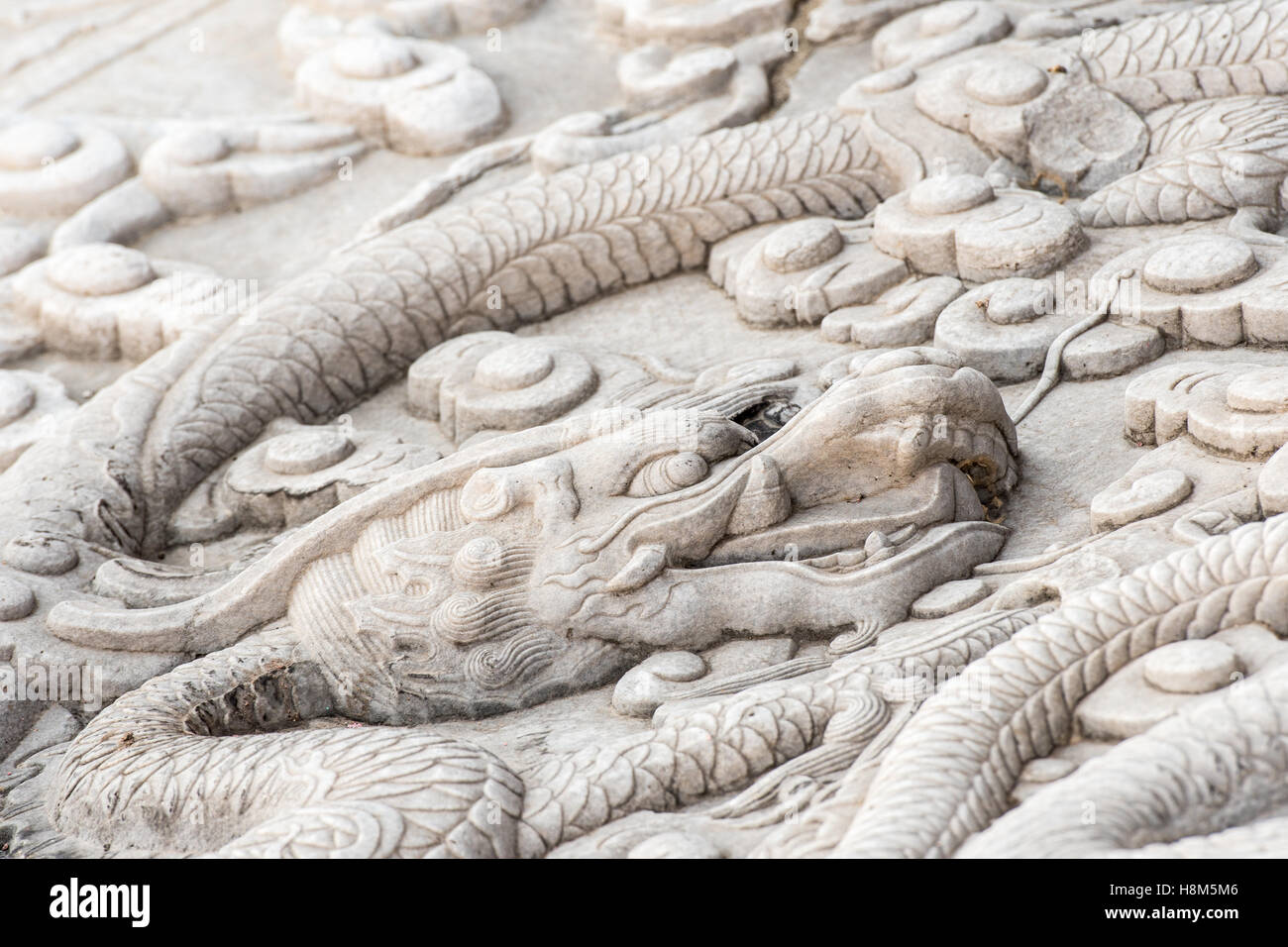 Beijing China - Detail of a relief sculpture of a dragon on a wall in ...