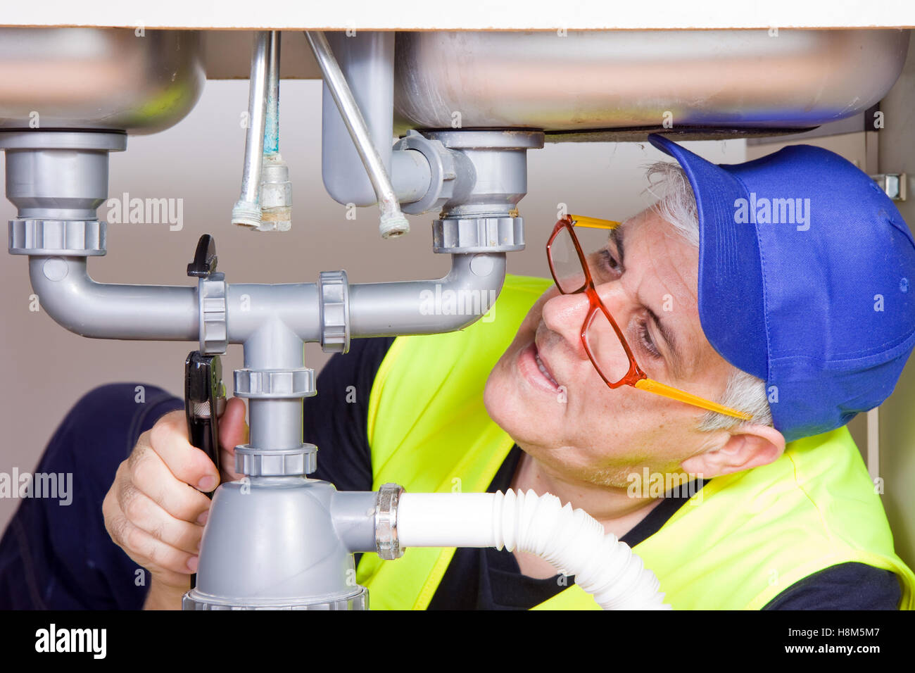 plumber at work in a building site Stock Photo - Alamy