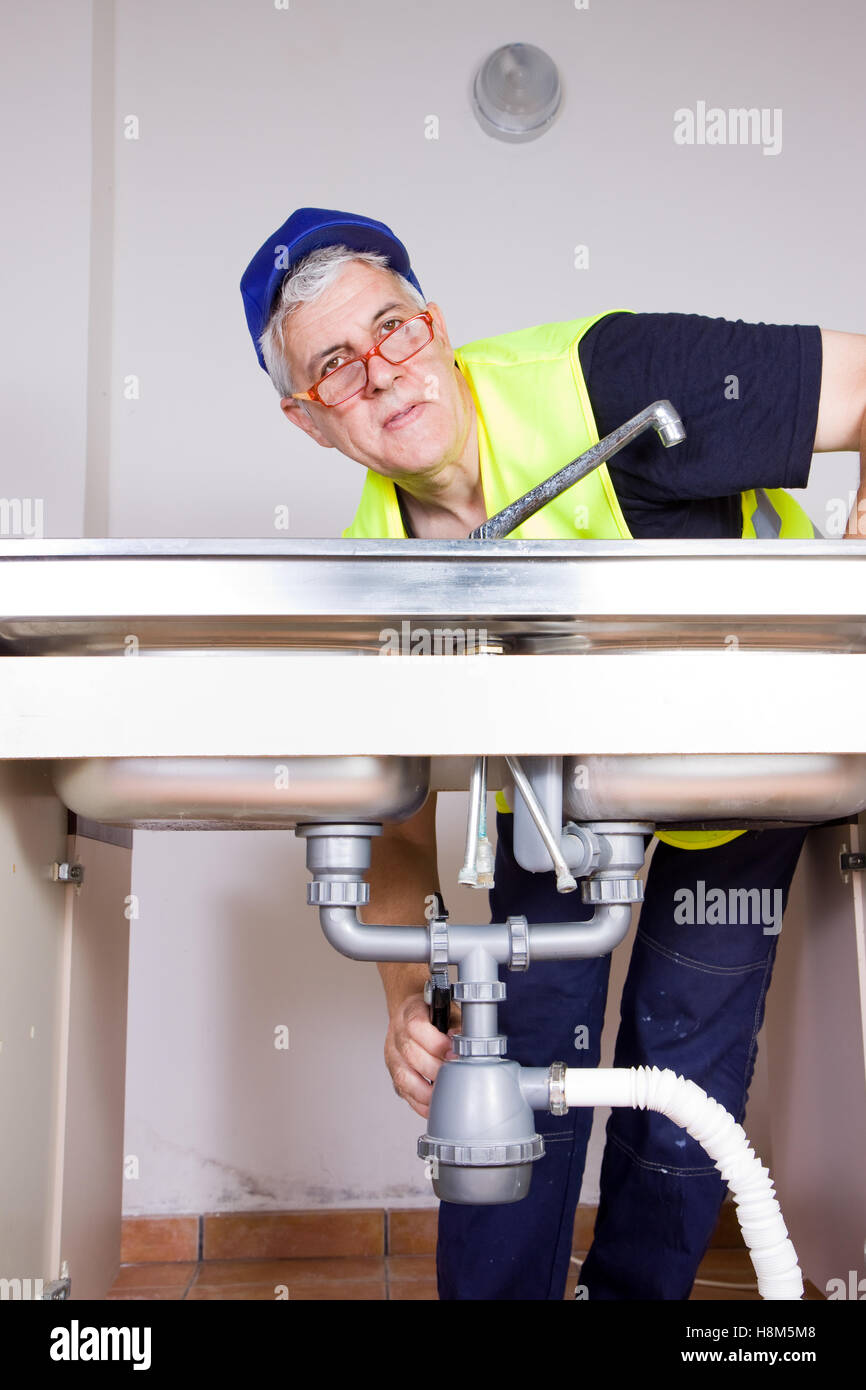 plumber at work in a building site Stock Photo - Alamy