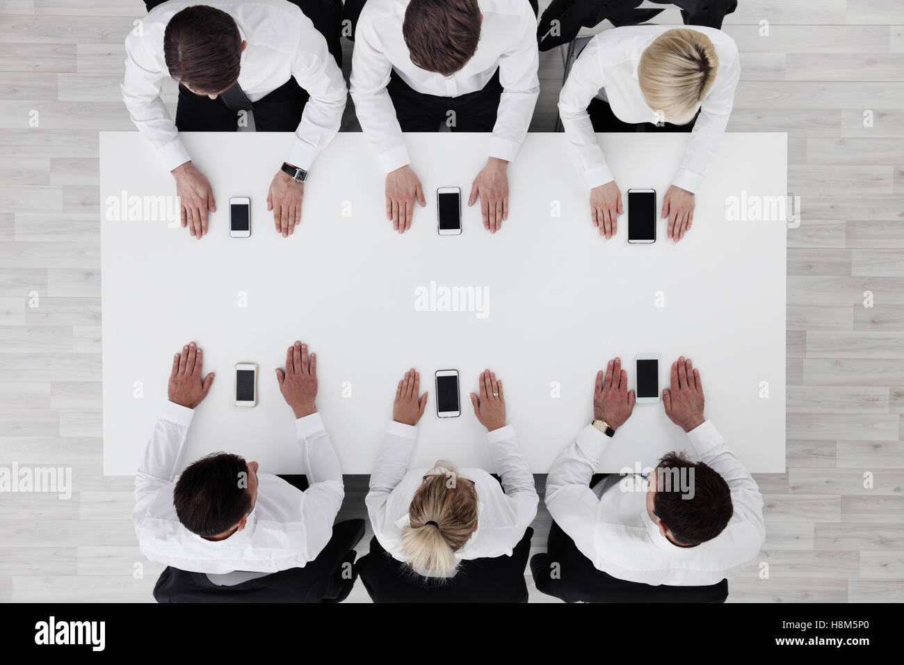 Group of business people around the table with mobile phones Stock ...