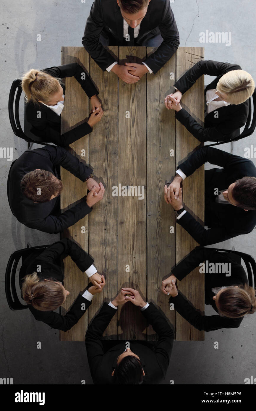 Group of business people team sitting around empty wooden table at ...