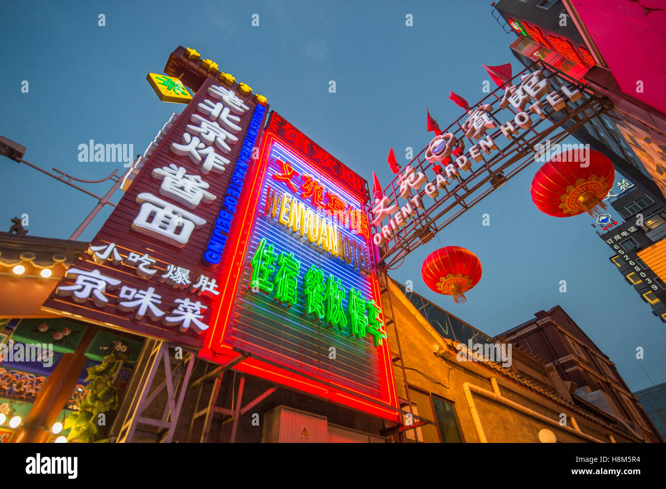Beijing, China - Brightly lit signs with Chinese characters in the ...