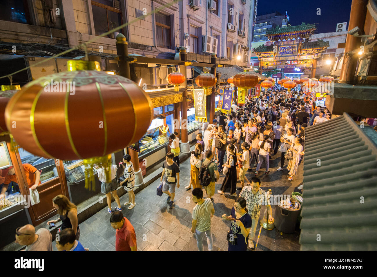 Beijing, China - Crowds of people walking through the Donghuamen Snack ...