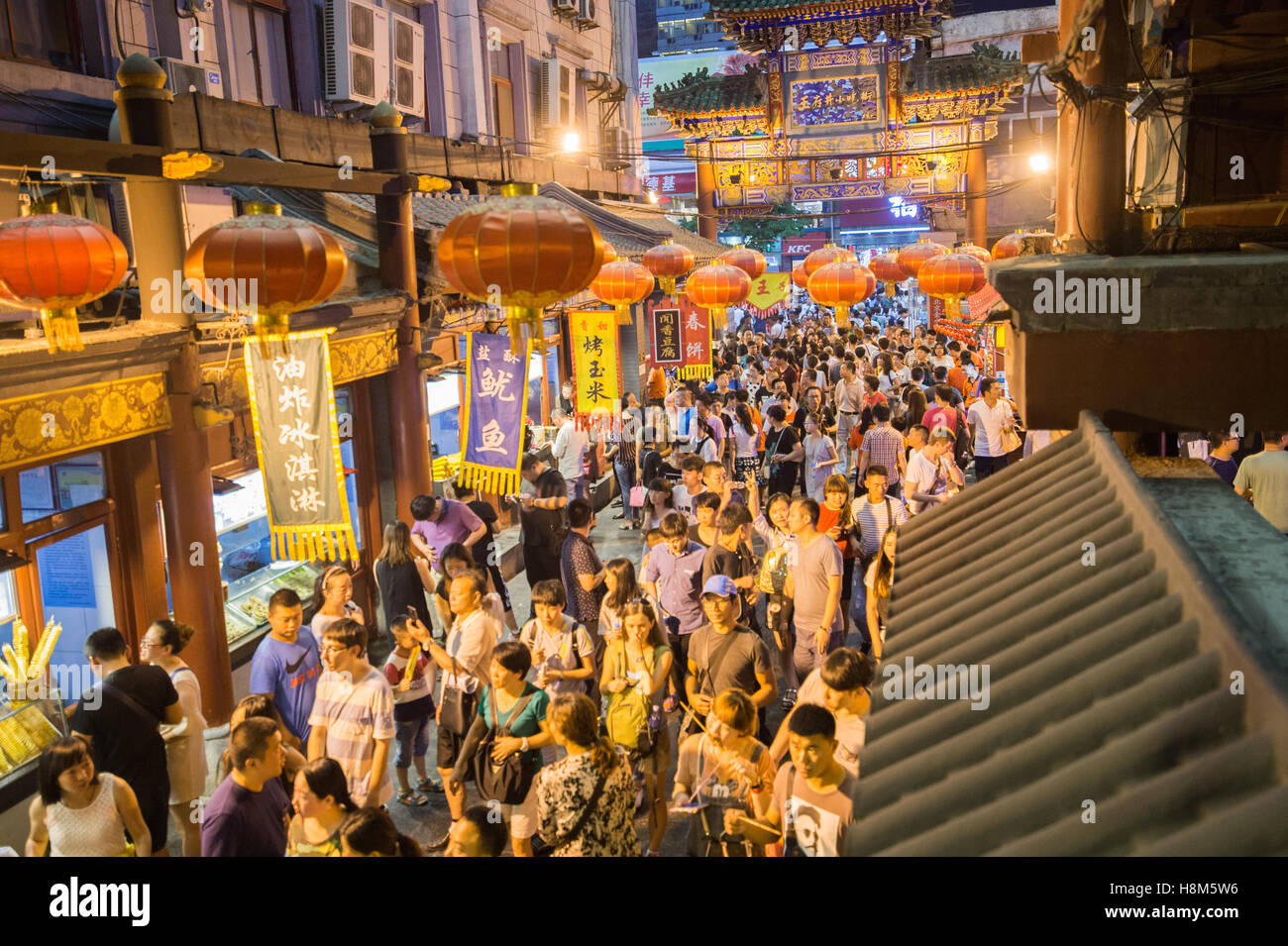 Beijing, China - Crowds of people walking through the Donghuamen Snack ...