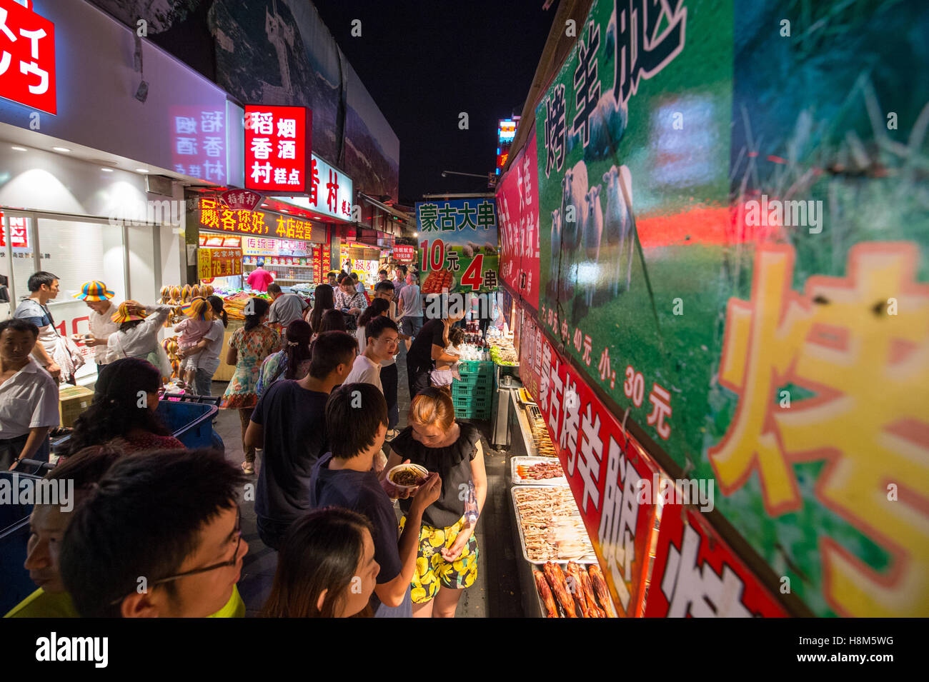 Beijing, China - Crowds of people walking through the Donghuamen Snack ...
