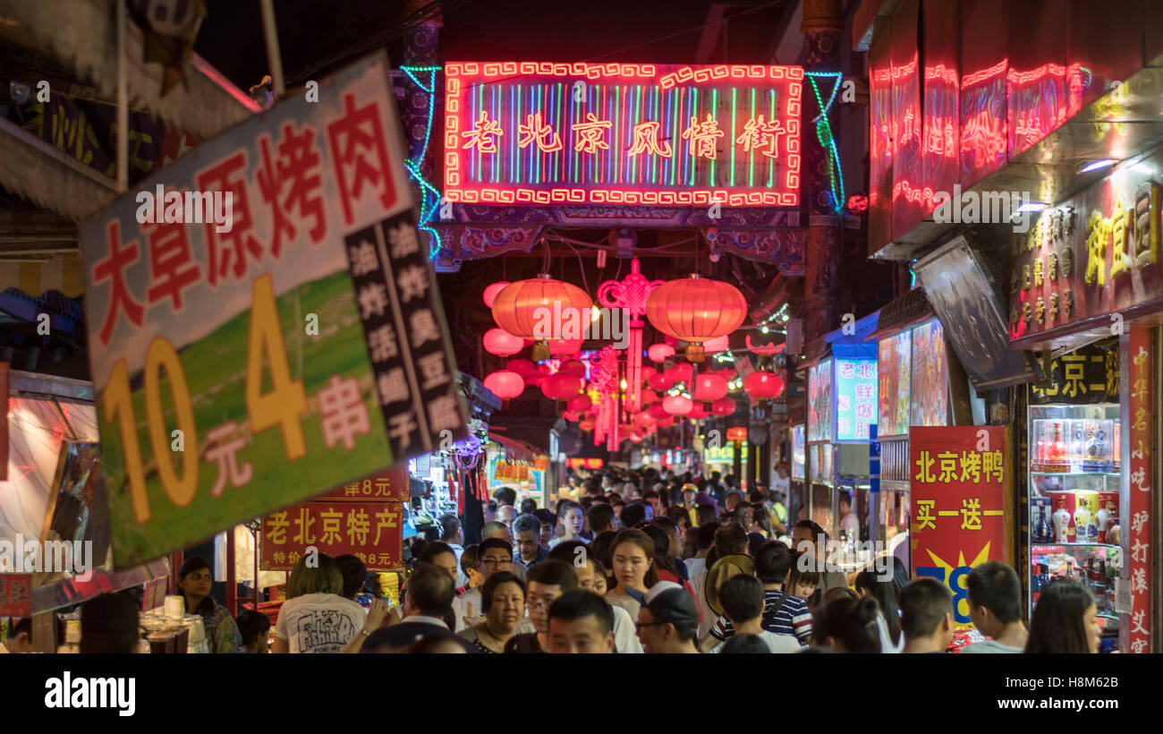 Beijing, China - Crowds of people walking through the Donghuamen Snack ...