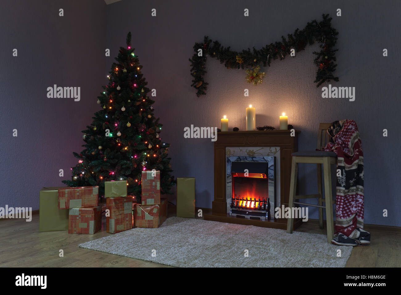 Christmas tree with gifts and fireplace in an empty room Stock Photo ...