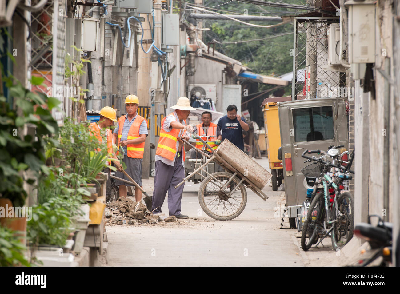 Beijing, China - Construction workers working in a Hutong located in ...