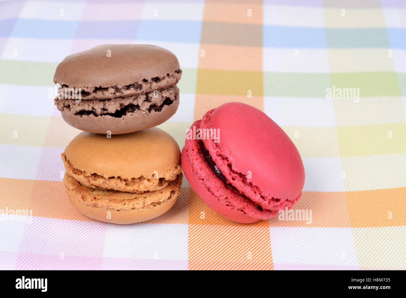 Three orange macaroon cookies hi-res stock photography and images - Alamy