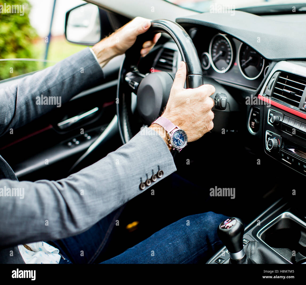 Young businessman driving car Stock Photo - Alamy