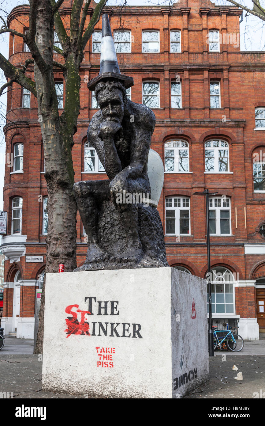 'The Drinker' a sculpture by Banksy, now amended by the artist AK47 and ...